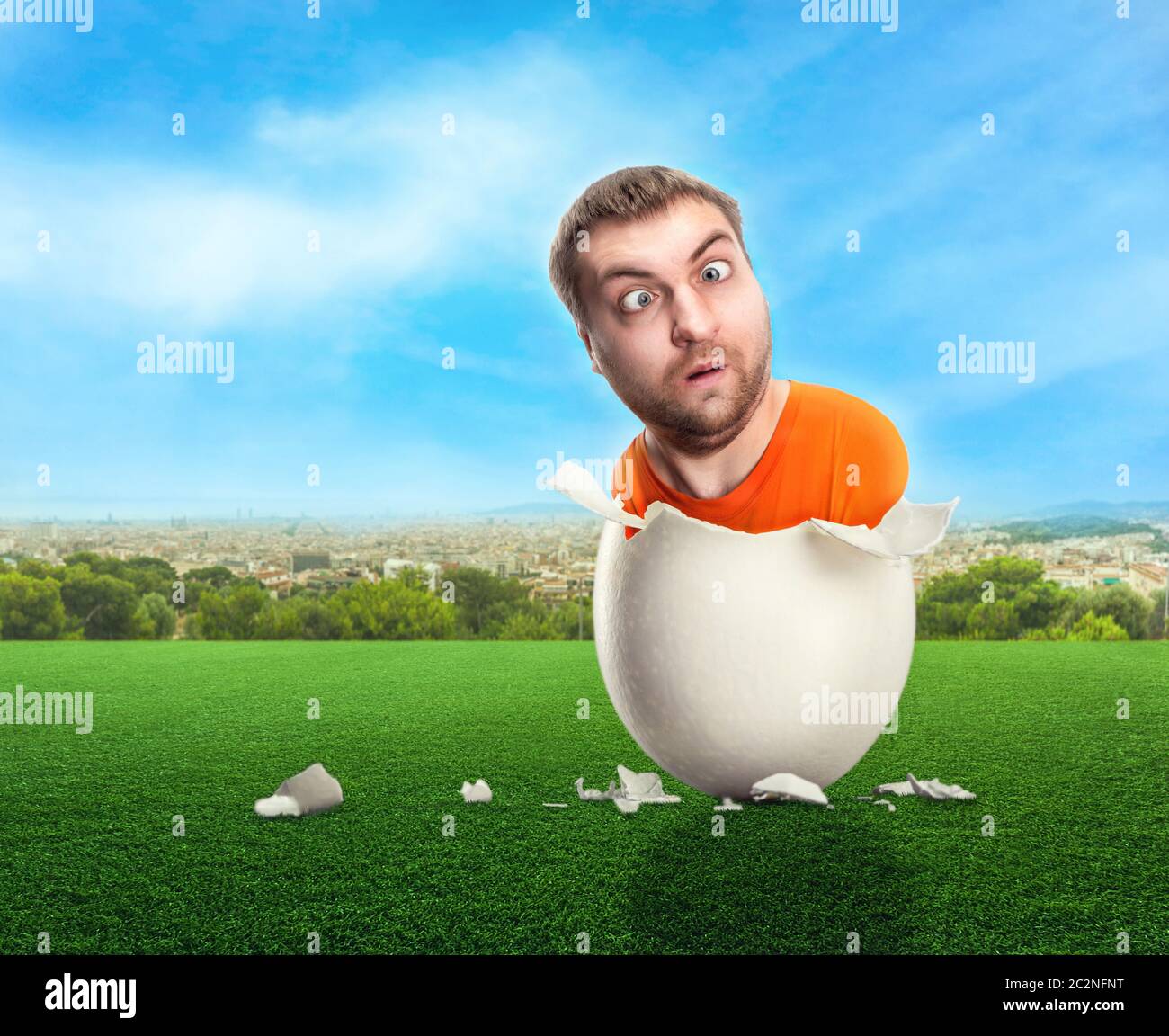 Strange man hatched out of the egg on the meadow Stock Photo - Alamy