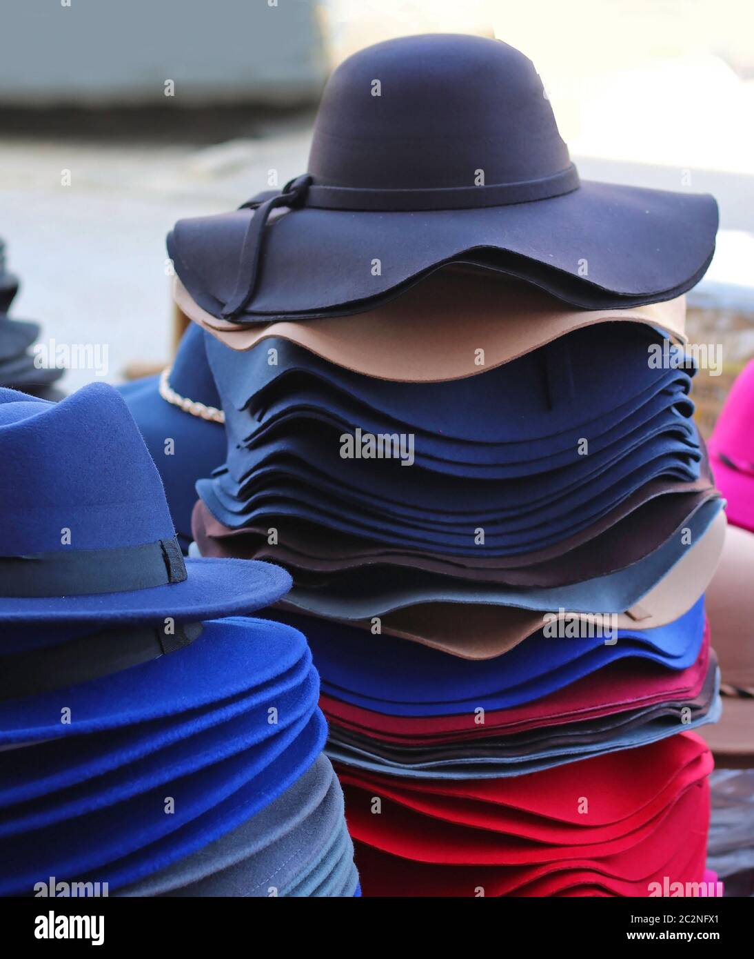 Pile of colorful autumn wool hats sold on market Stock Photo - Alamy