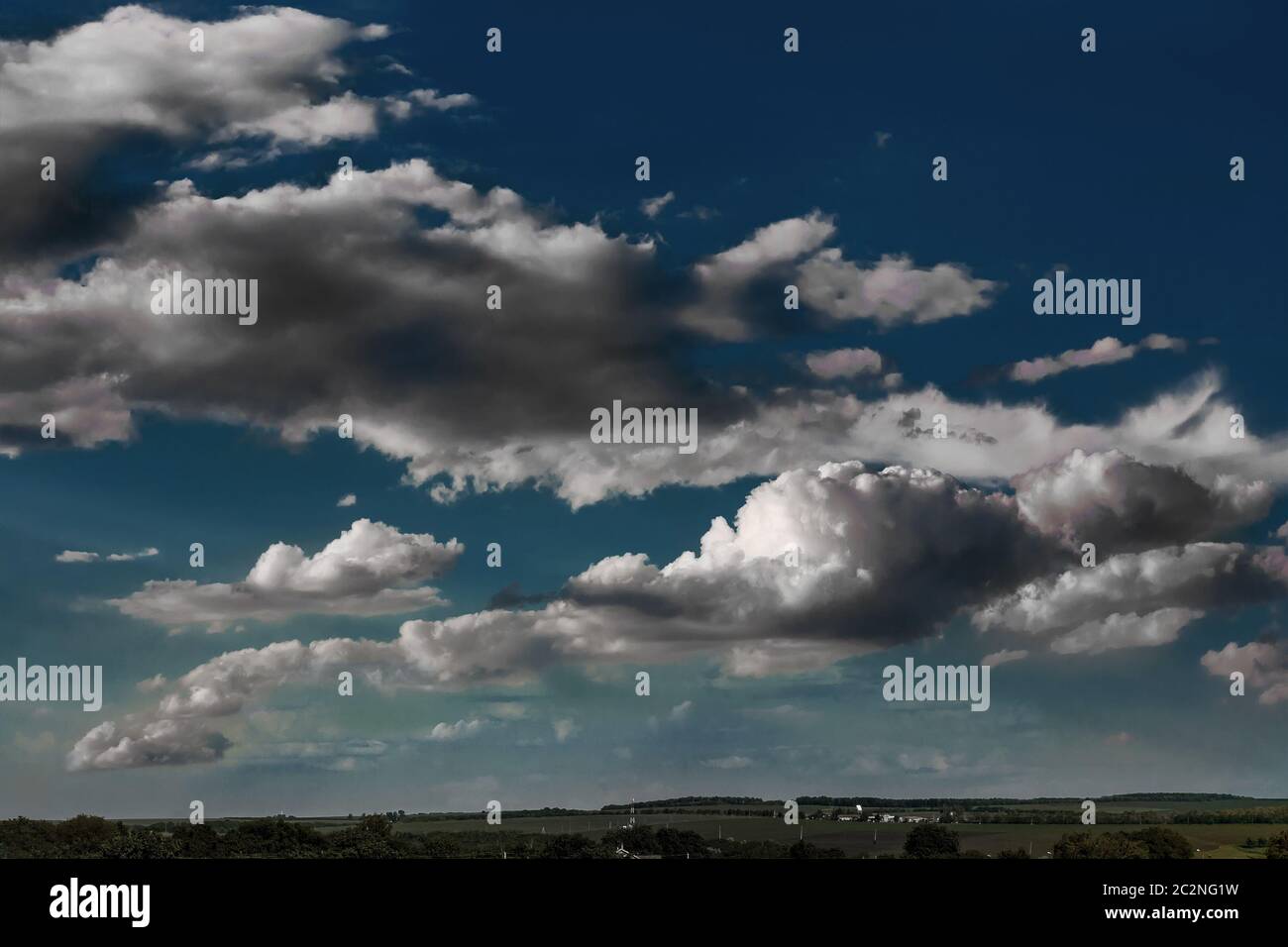 Clouds above the ground Stock Photo - Alamy