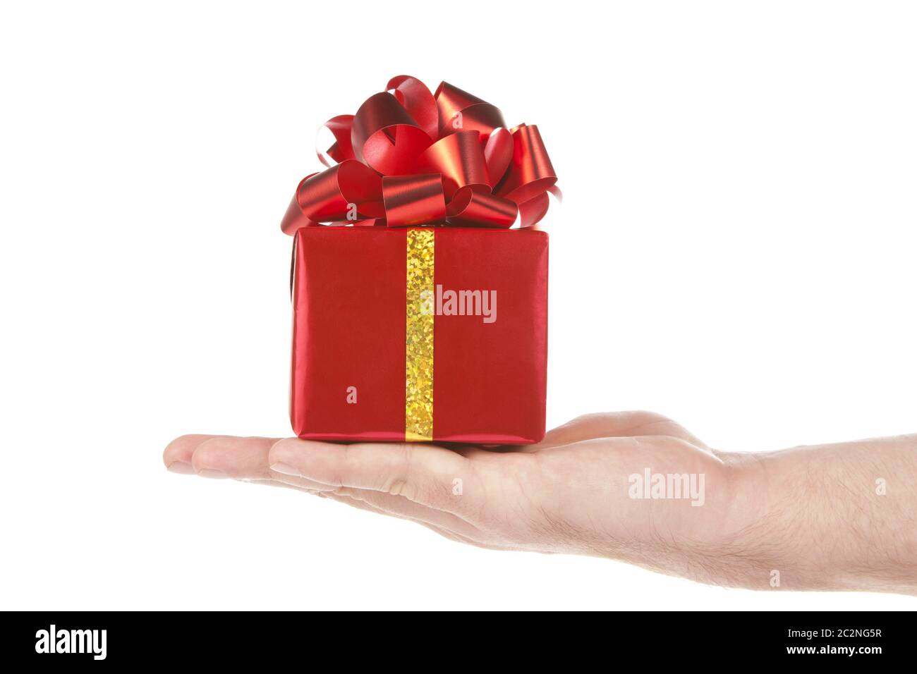 Small red gift in palm of hand. Isolated on white Stock Photo - Alamy