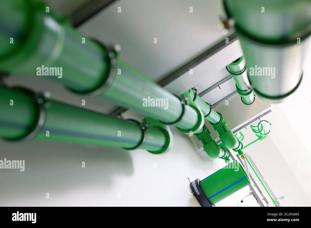 Green pipelines - water supply system Stock Photo - Alamy