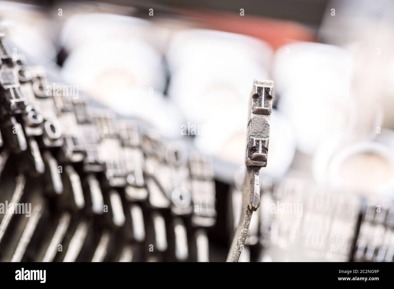 Retro writing machine type bars closeup. Vintage typewriter letters ...