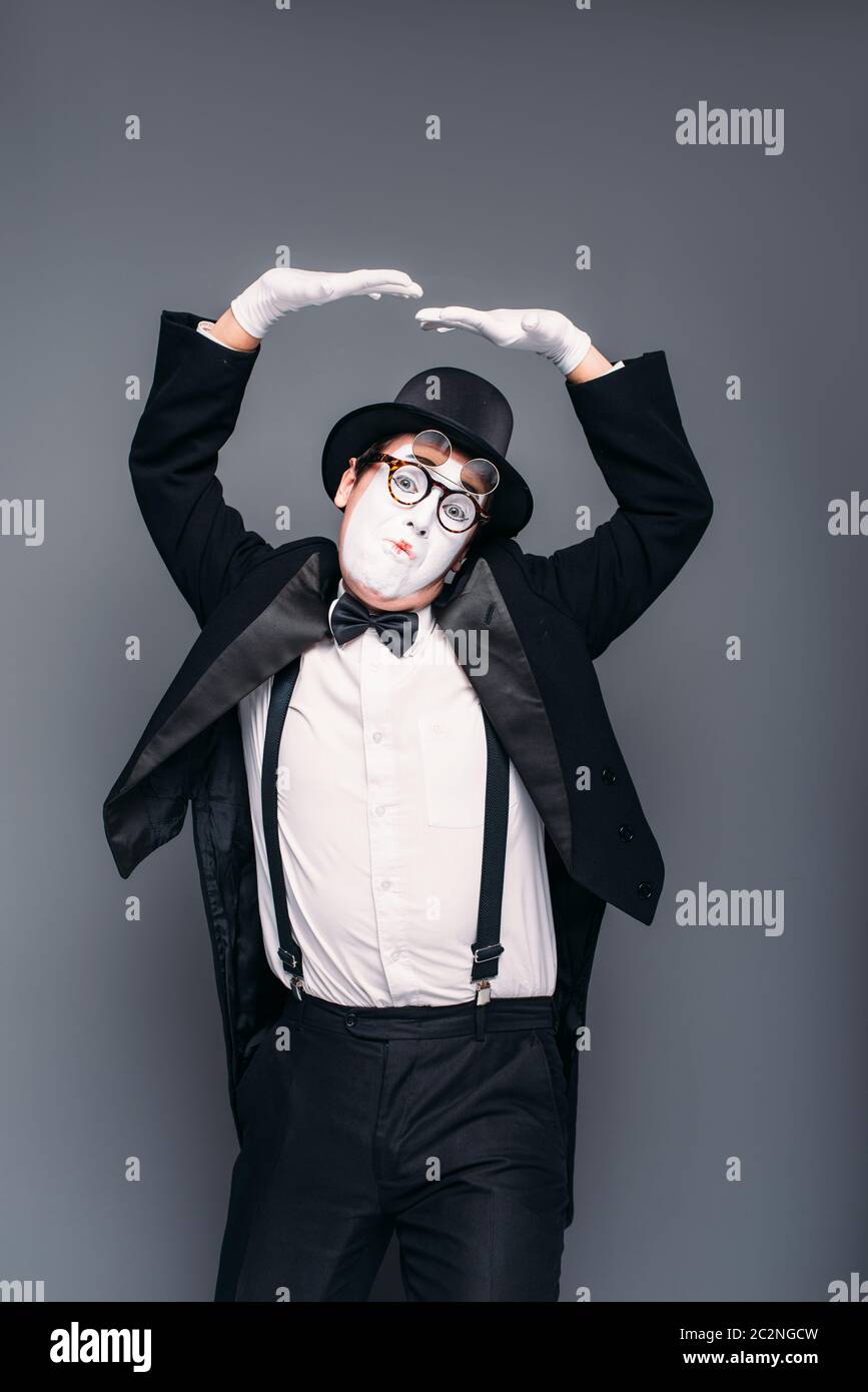 Male mime actor fun mimic performing. Pantomime in suit, gloves ...