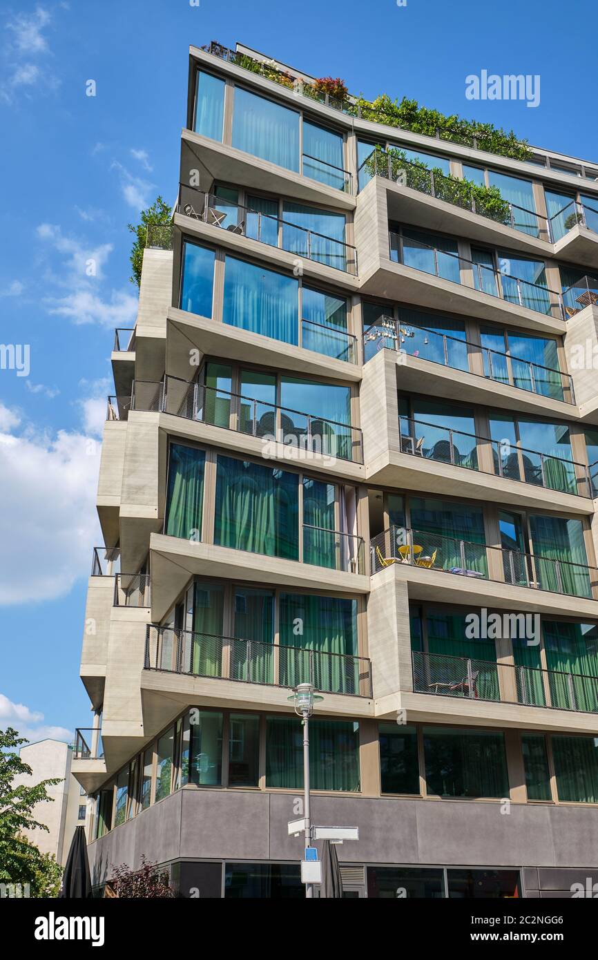 Contemporary apartment building with floor-to-ceiling windows seen in ...