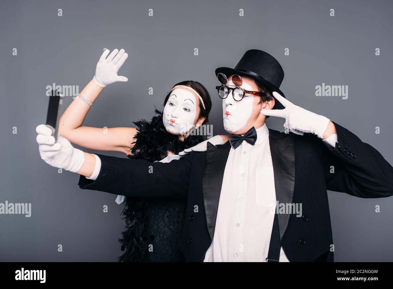 Two pantomime theater performers makes selfie on camera. Mime actor and ...