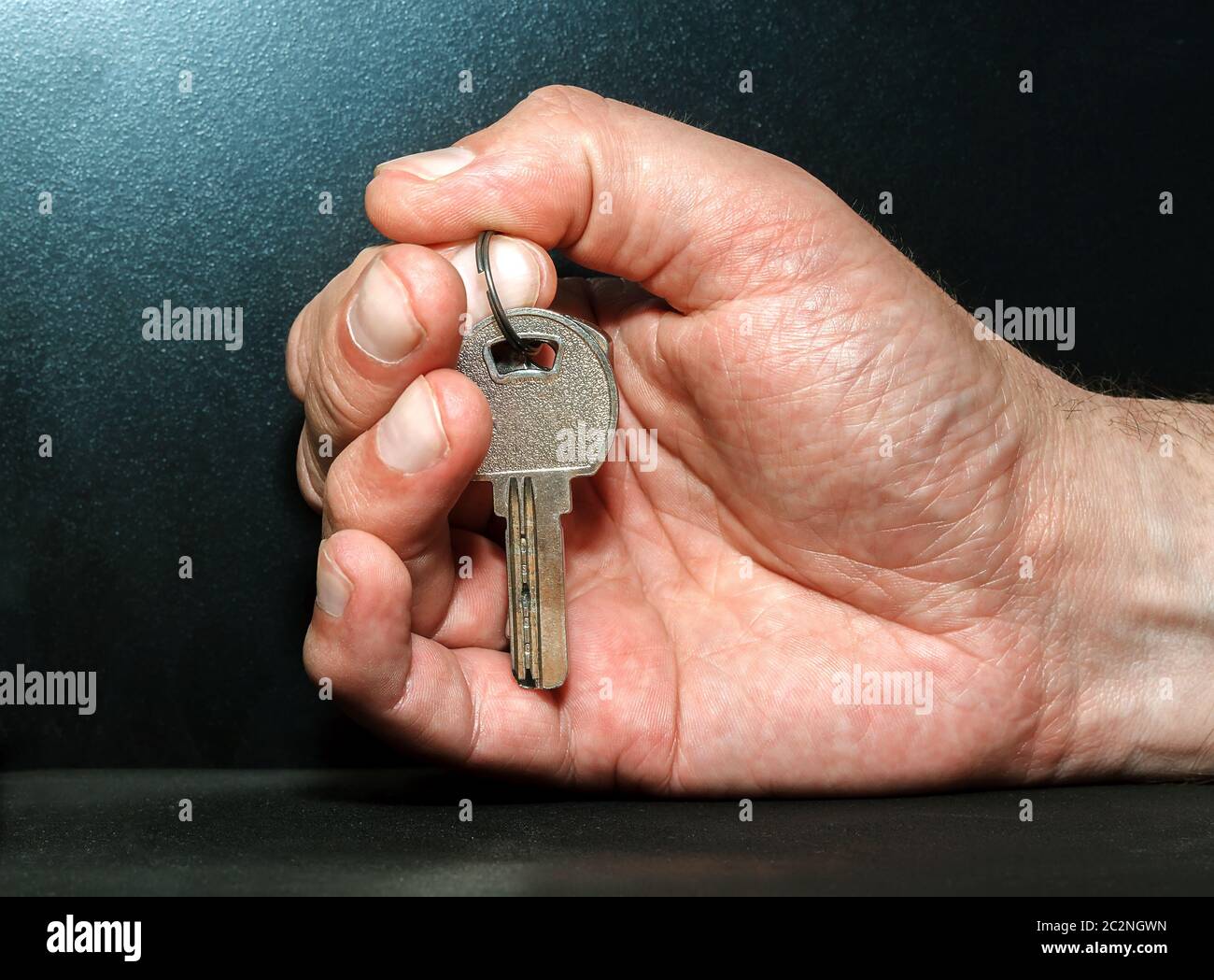 Hand with keys Stock Photo - Alamy