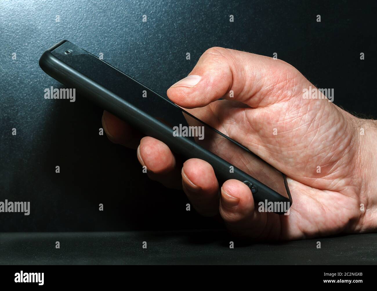 Phone hand dark hi-res stock photography and images - Alamy