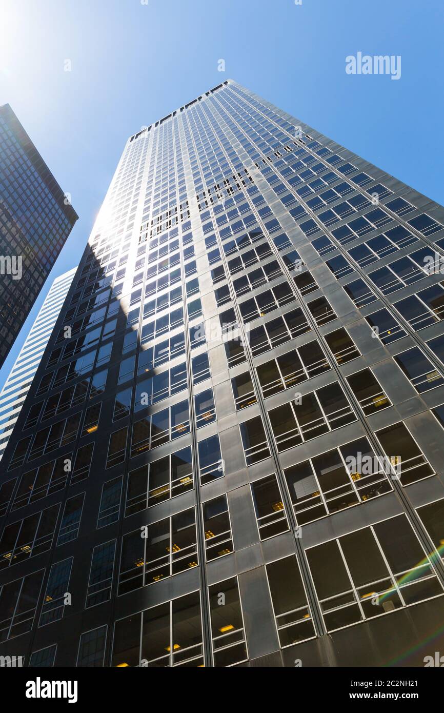 Big skyscraper made of glass and concret. Glassed wall of hight house ...