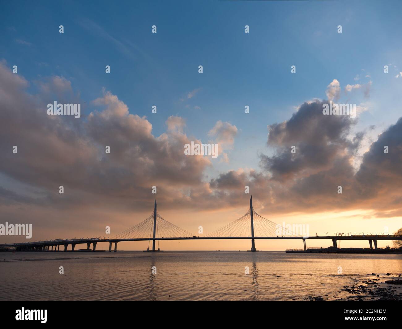 Beautiful bridge over the river on the cables is road Stock Photo - Alamy