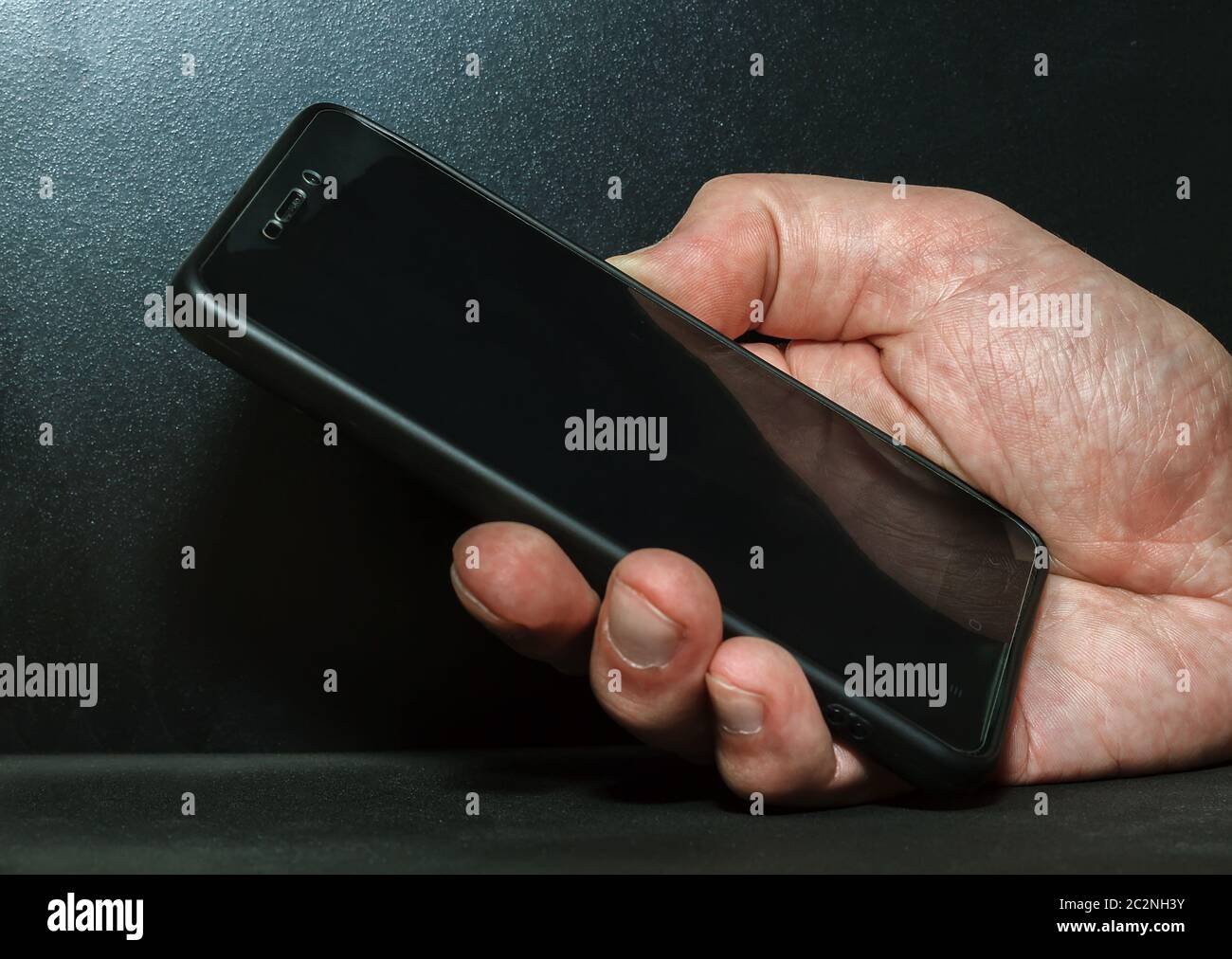 Hand with a mobile phone Stock Photo - Alamy