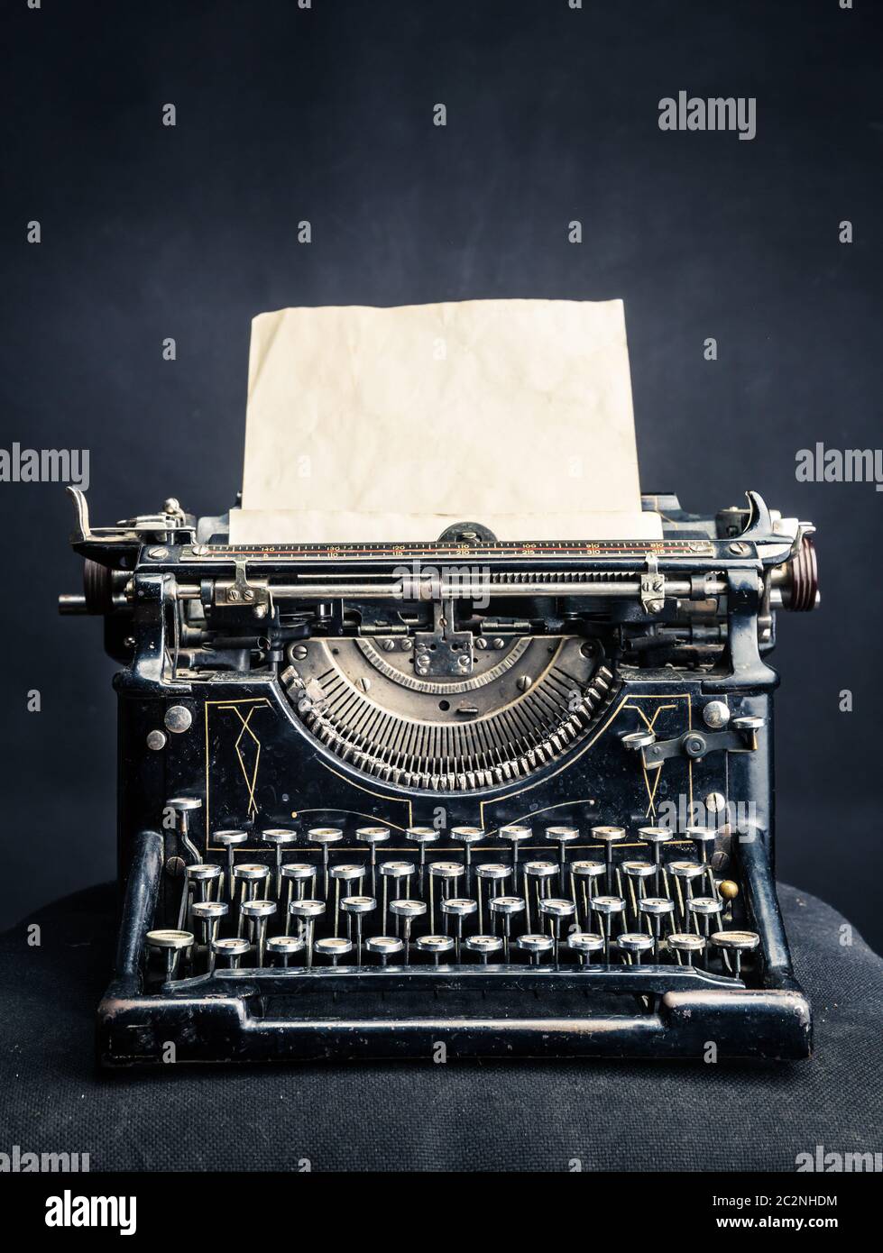 Vintage black typewrite with inserted paper sheet. Antique type writer ...