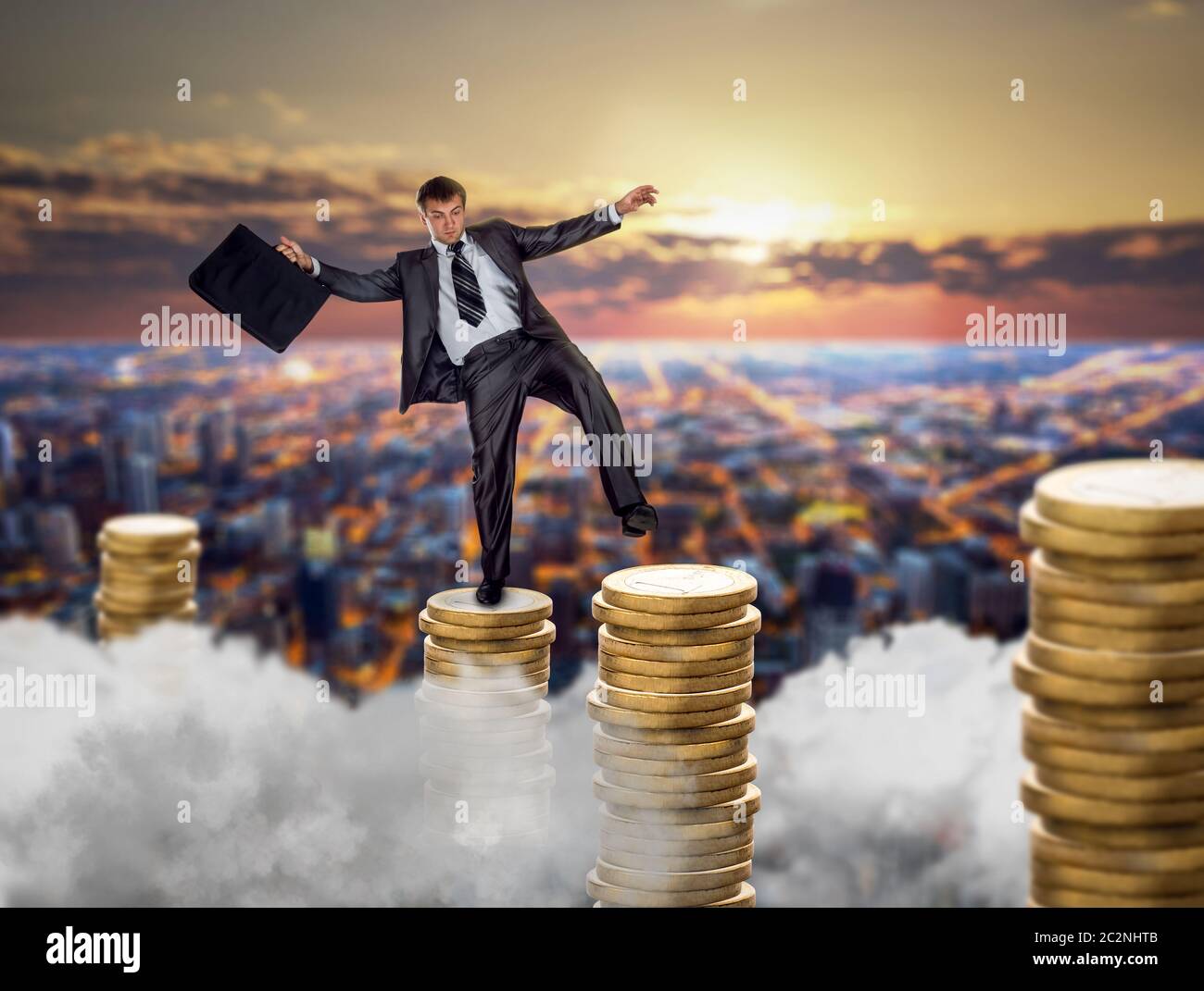 Businessman jumping on stacks of coins. Fragile unstable business ...