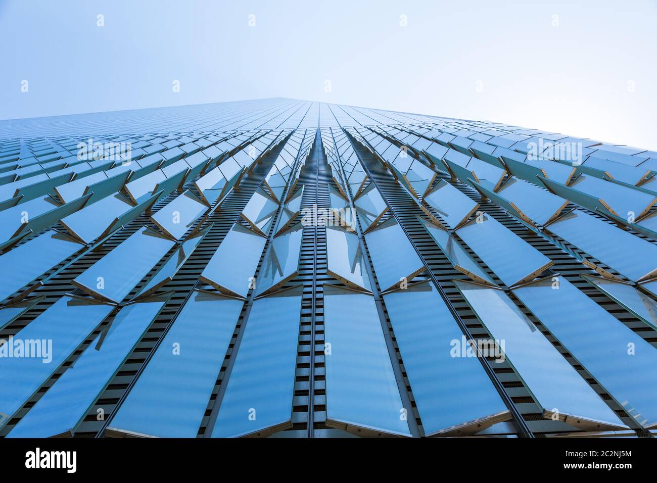 Unusual wall construction of skyscraper. Bottom view on big building ...