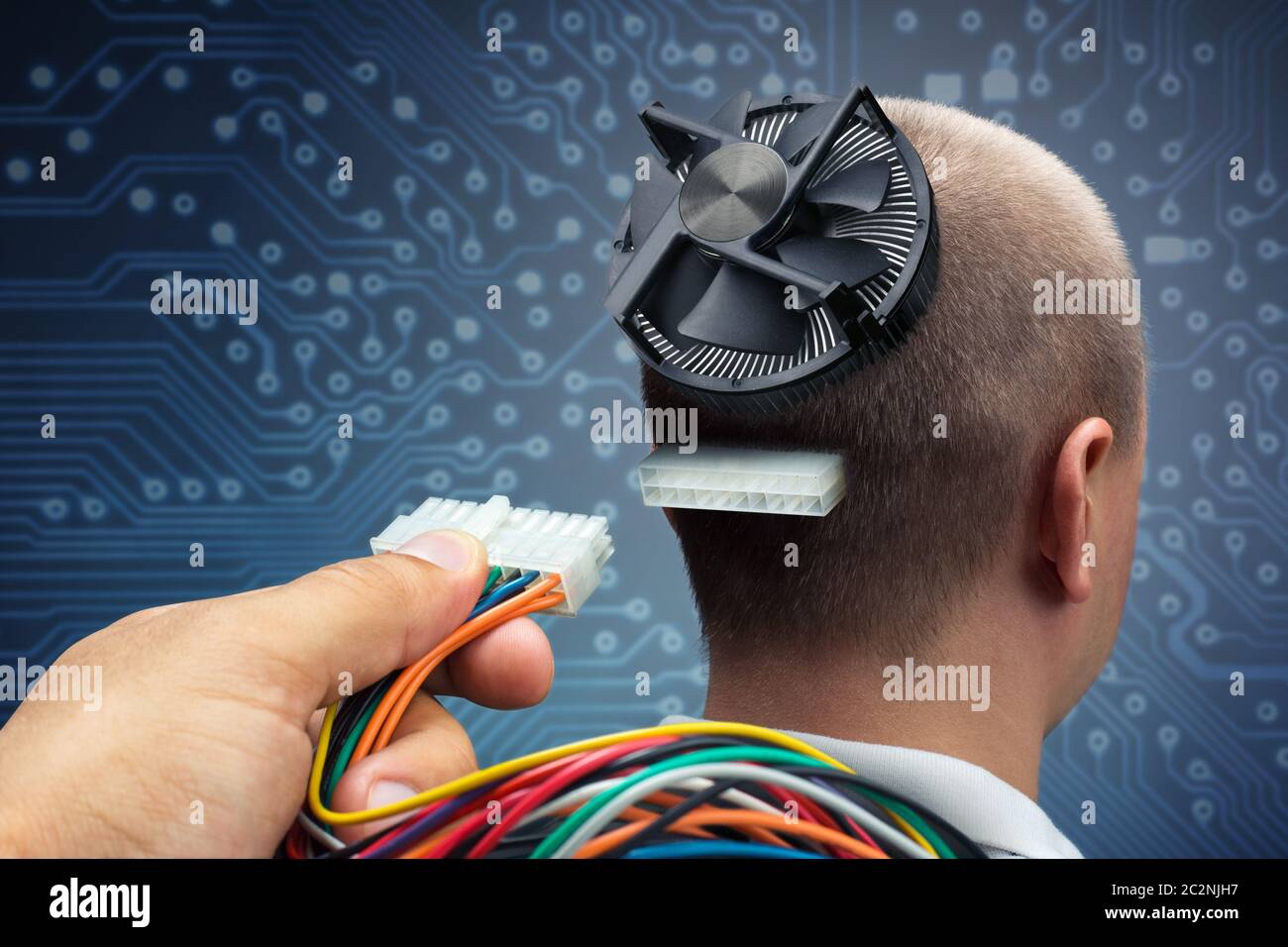 Hand plugging power cables into the head of cyborg Stock Photo - Alamy