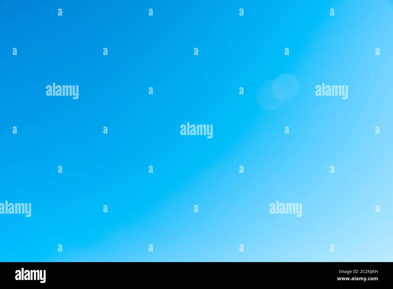 Blue background faded or transitioning to lower right corner with lens ...