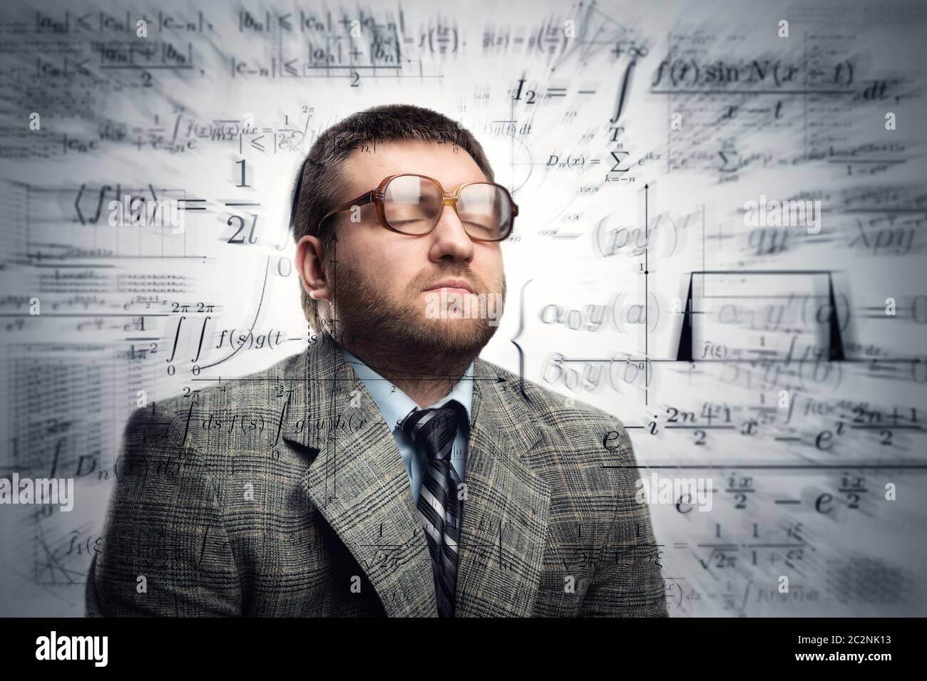 Professor in glasses thinking about math formulas Stock Photo - Alamy