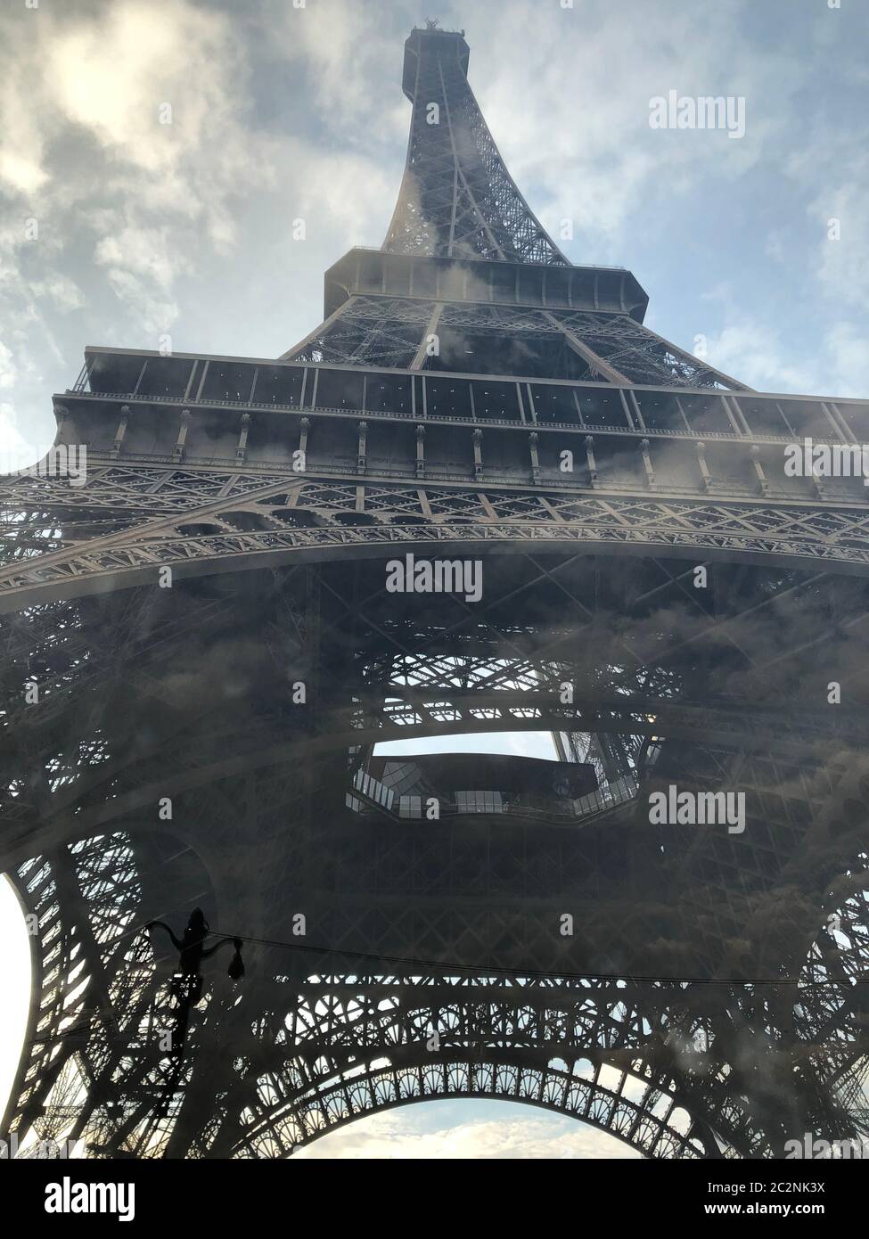 An Eiffel Tower view with the reflection through the glass wall in ...