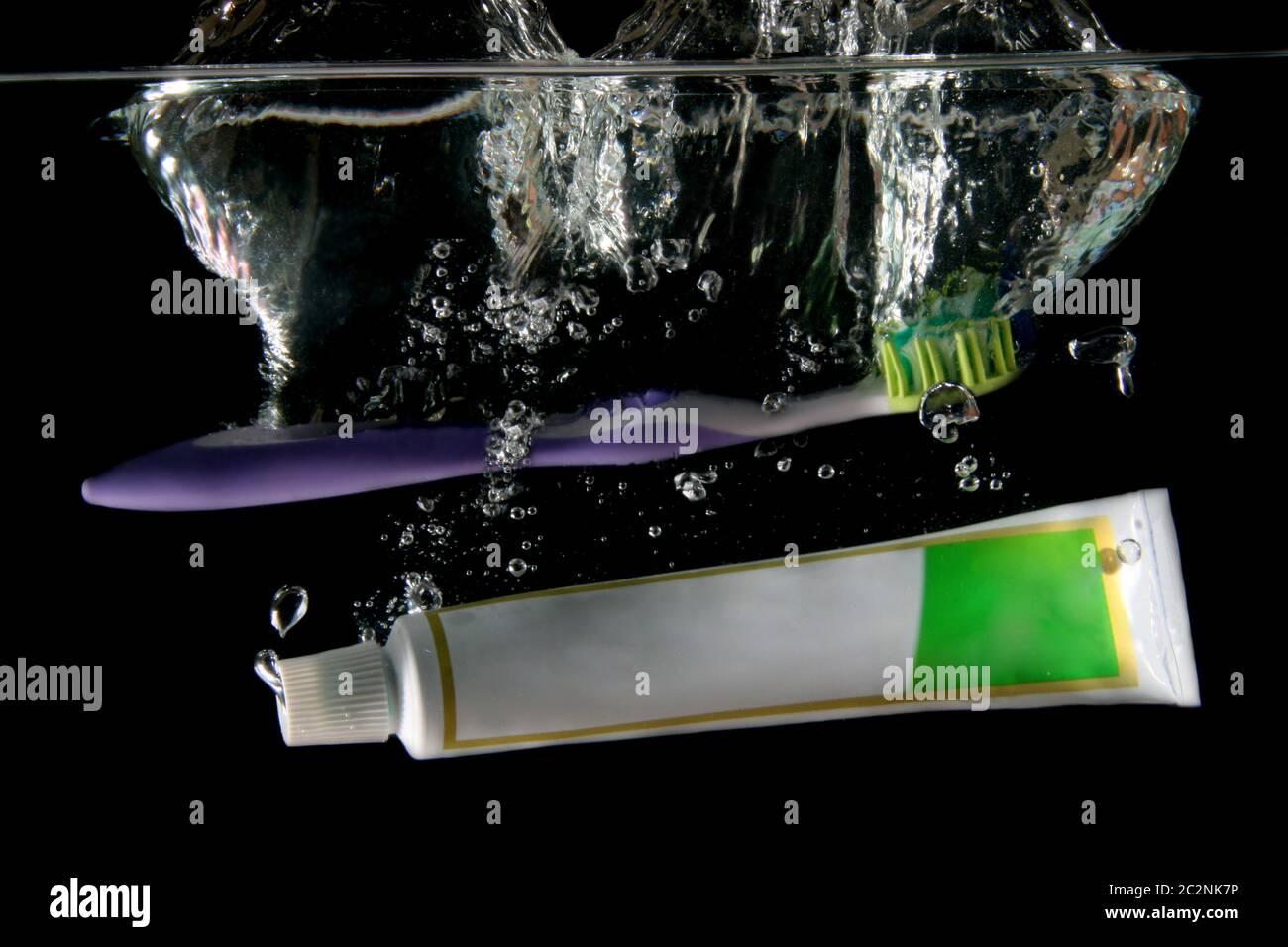 Toothpaste and toothbrush under water Stock Photo - Alamy