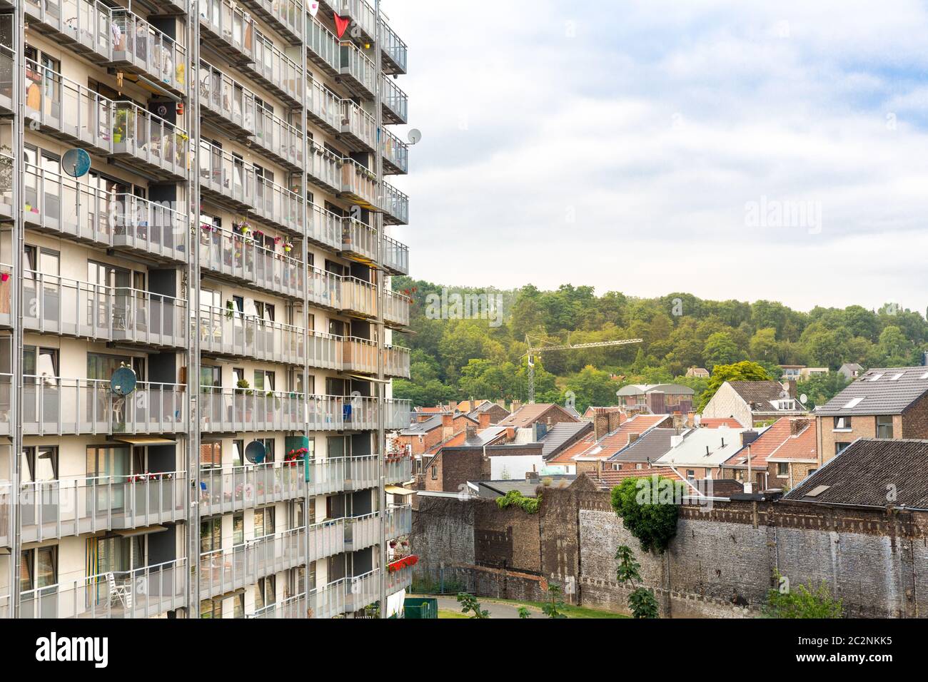 Typical block apartment building facade with many balconies, Europe ...