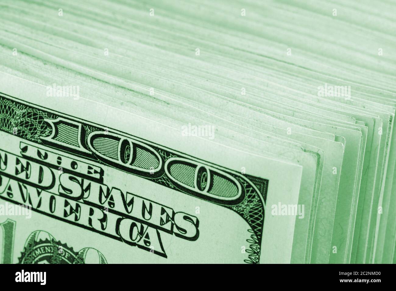 Big stack of $100 banknotes. Close-up view. Toned Stock Photo - Alamy