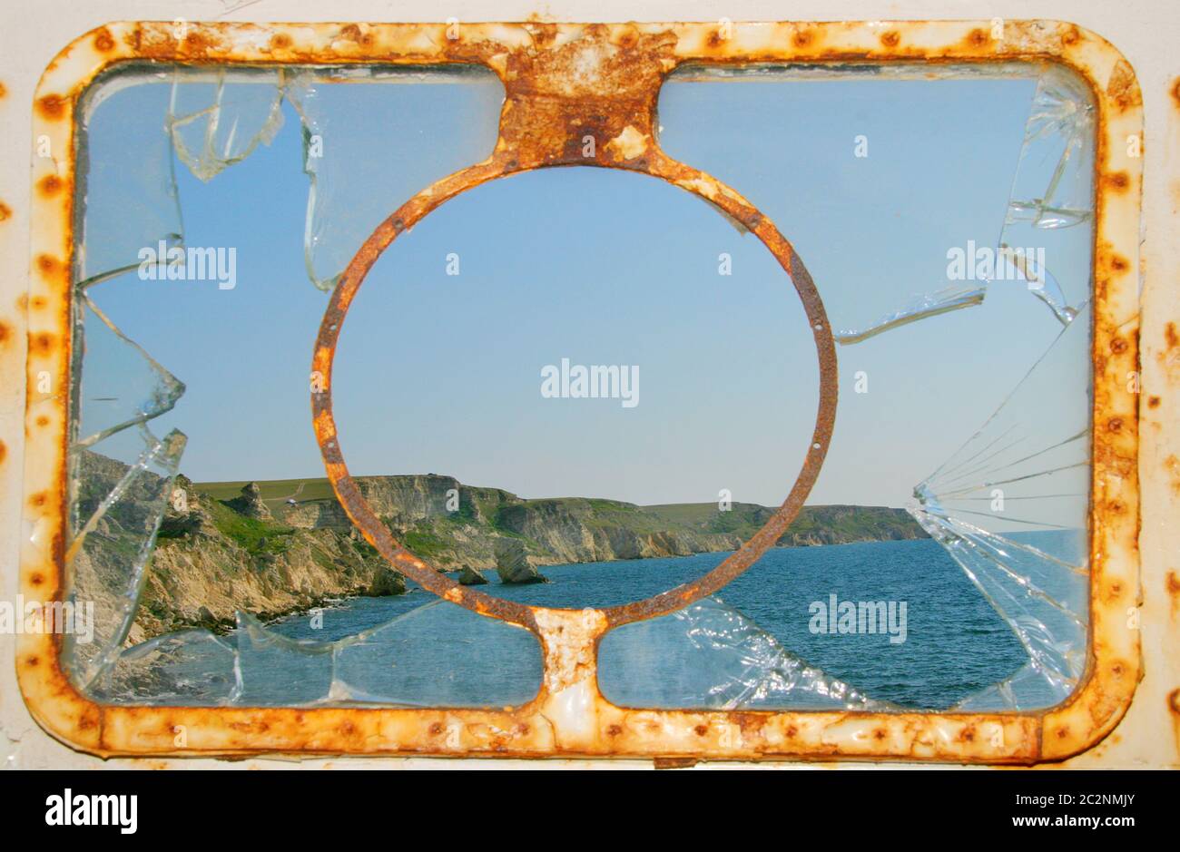 Shipwreck. Rusty abandoned cargo ship near mountain coast. Broken ...