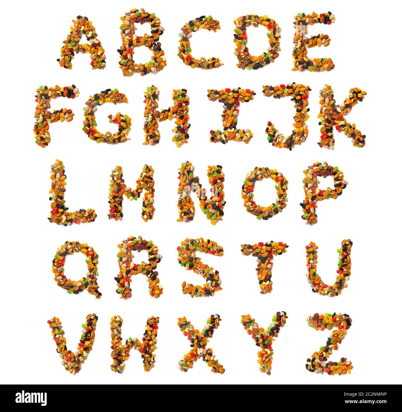 English alphabet from a mixture of hazelnuts, almonds, walnuts, cashews ...