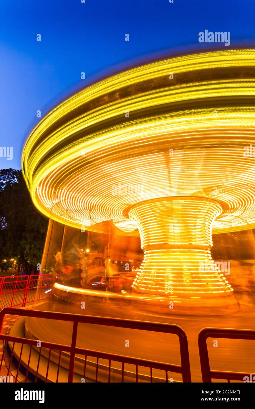Fast merry-go-round lighting in the hight Stock Photo - Alamy