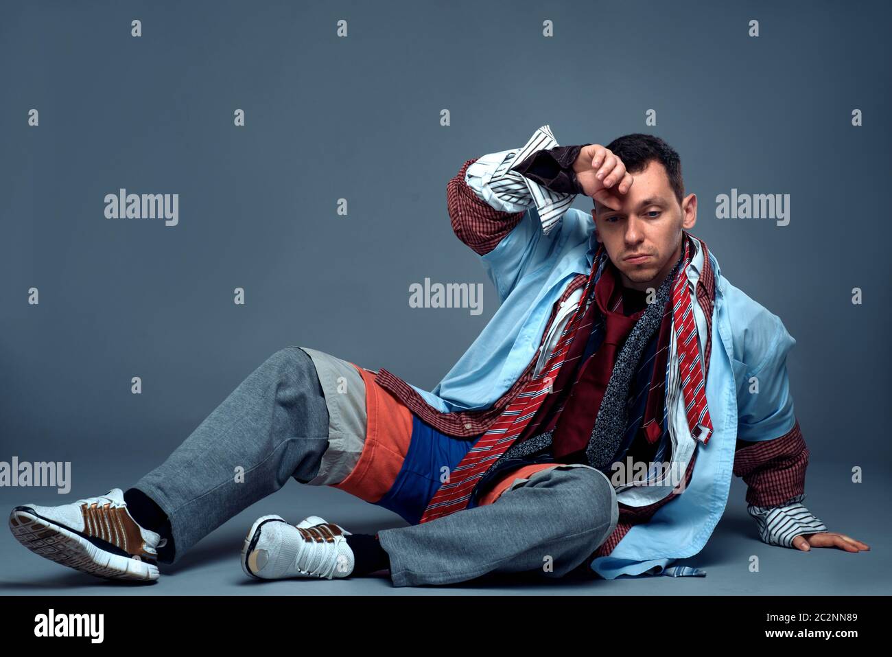 Tired male consumer after clothes sale. Shopping concept. Doomed man ...