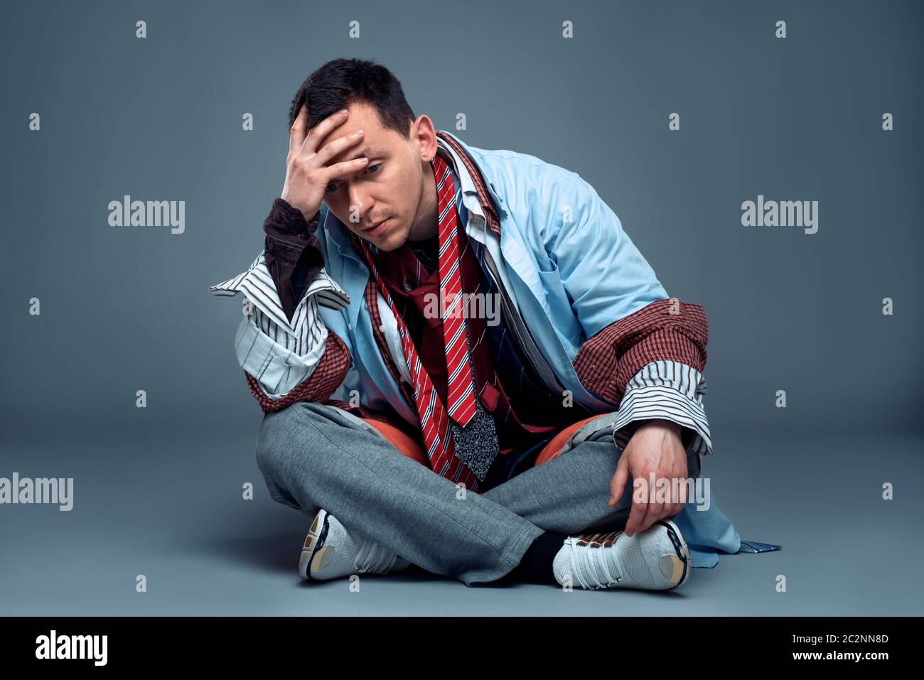 Tired male consumer after clothes sale. Shopping concept. Doomed man ...