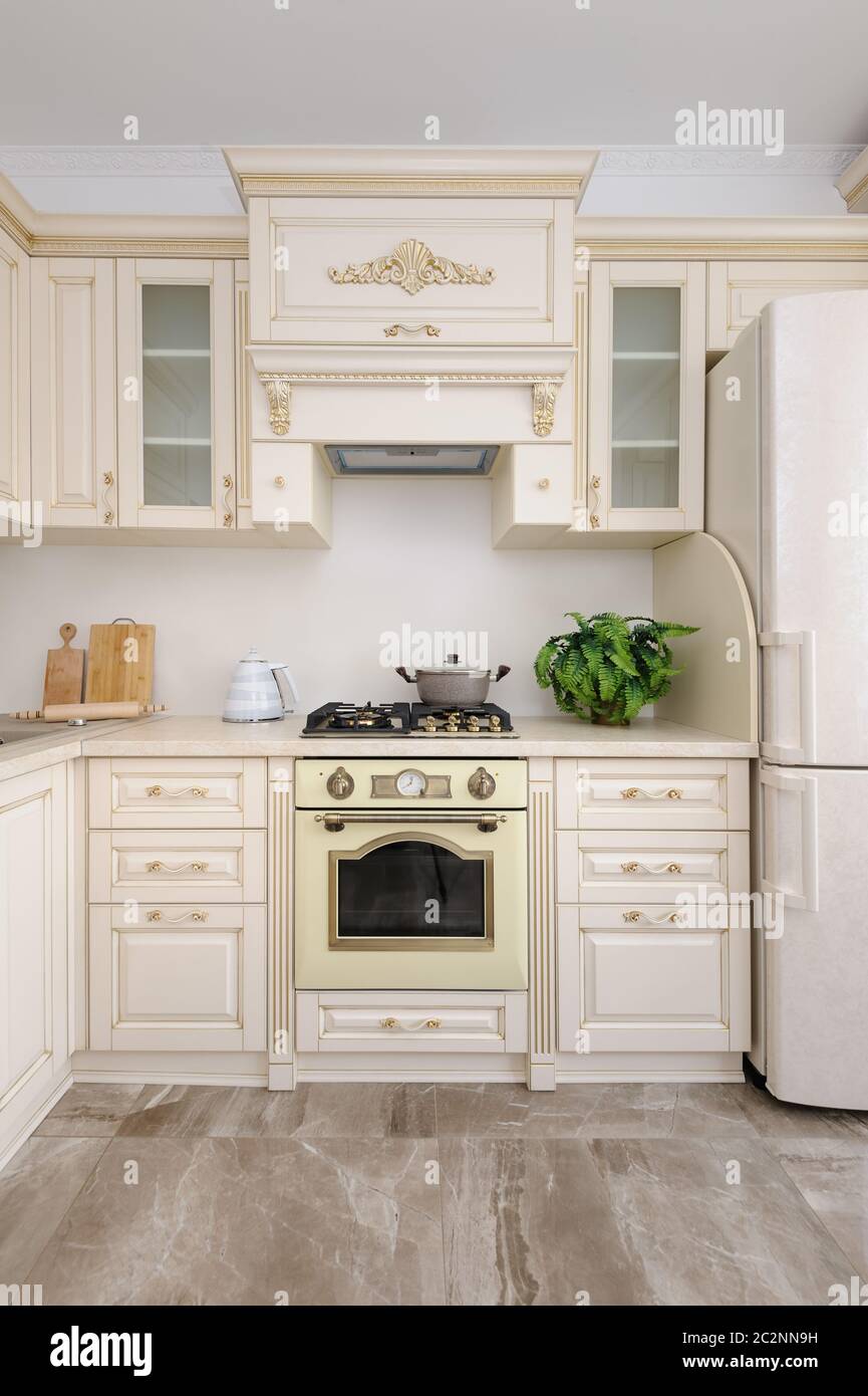 Modern beige colored luxury kitchen Stock Photo - Alamy