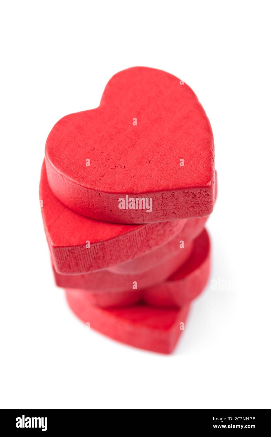 Stack of red wooden hearts, isolated on white Stock Photo - Alamy