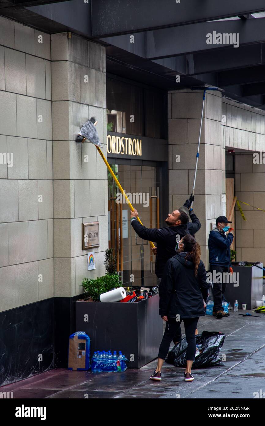 Seattle residents clean up the streets after the previous night's ...