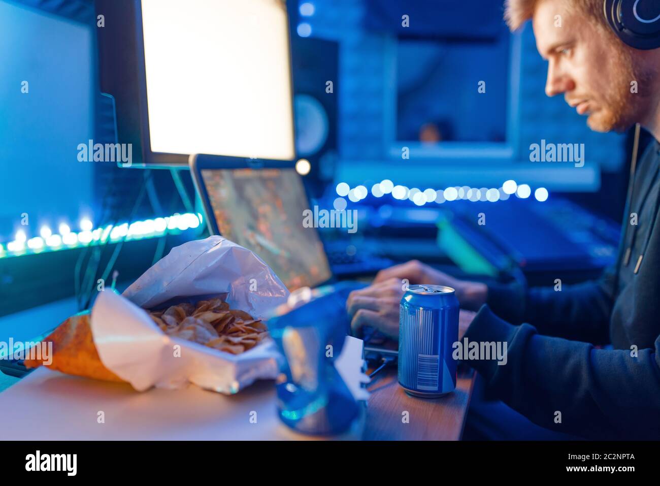 Male gamer with joystick playing videogame on desktop PC, gaming ...