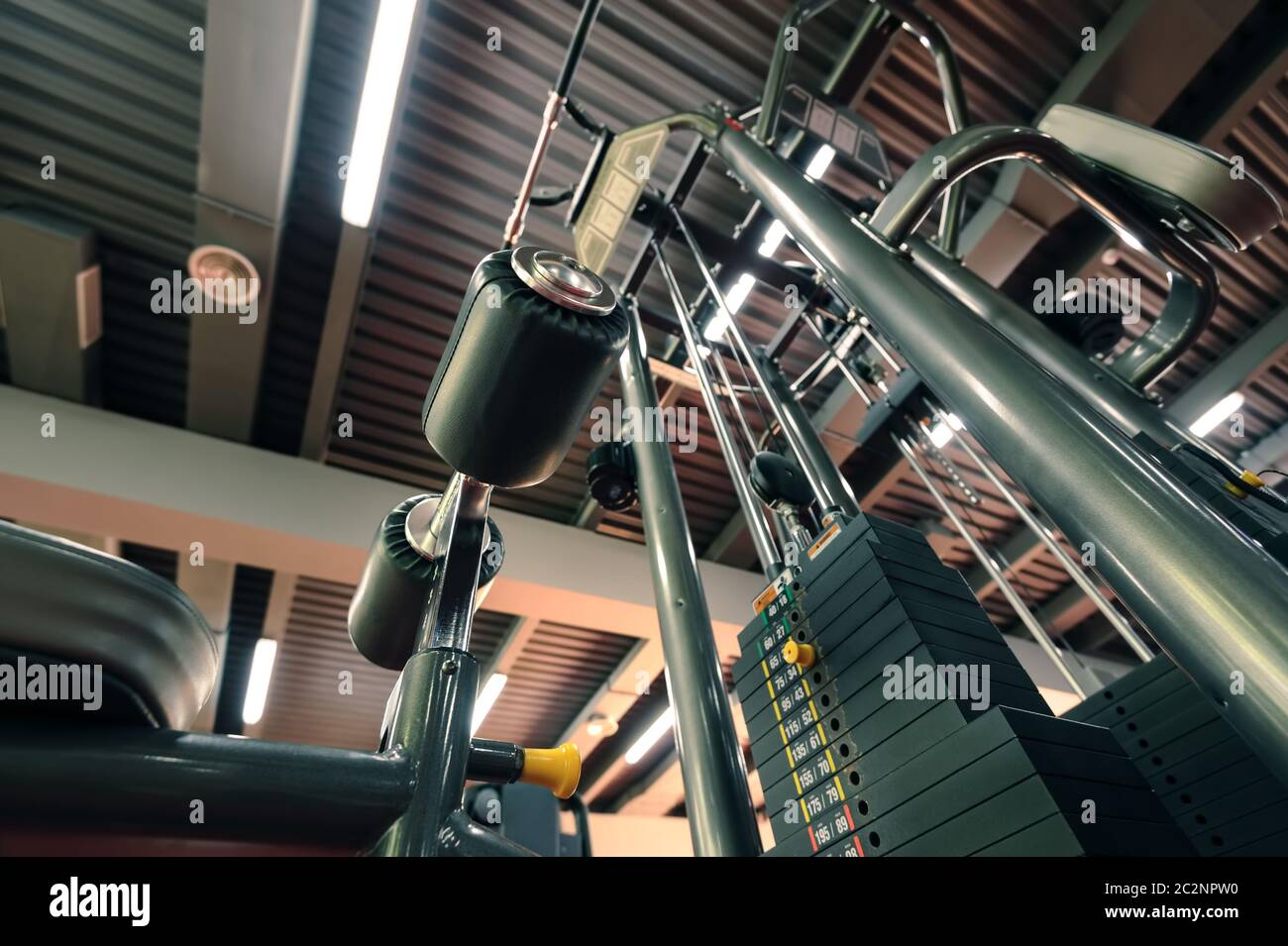 Weights in gym machine Stock Photo - Alamy