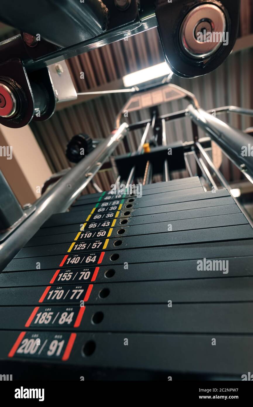 Weights in gym machine Stock Photo - Alamy