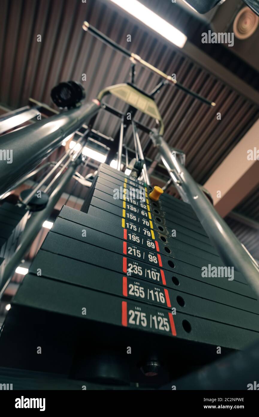 Weights in gym machine Stock Photo - Alamy