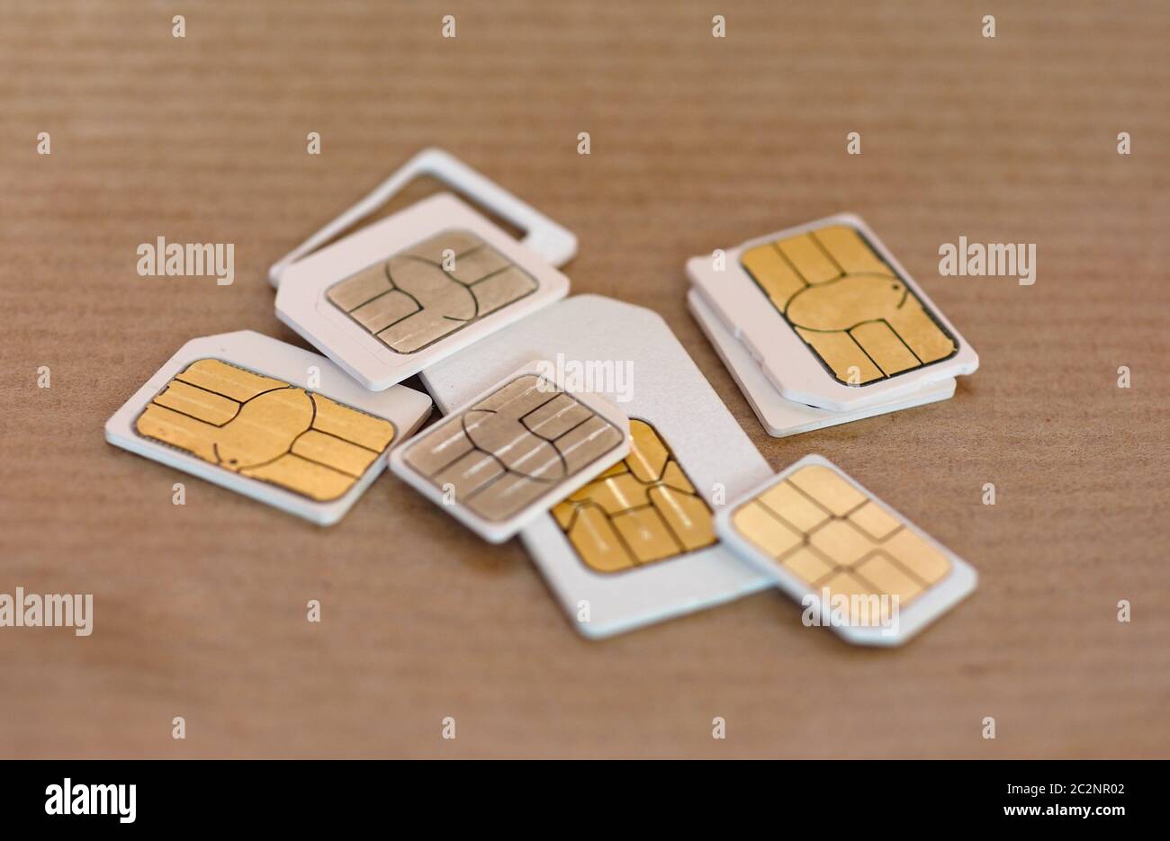Many mini micro and nano sim cards for mobile telephone Stock Photo - Alamy