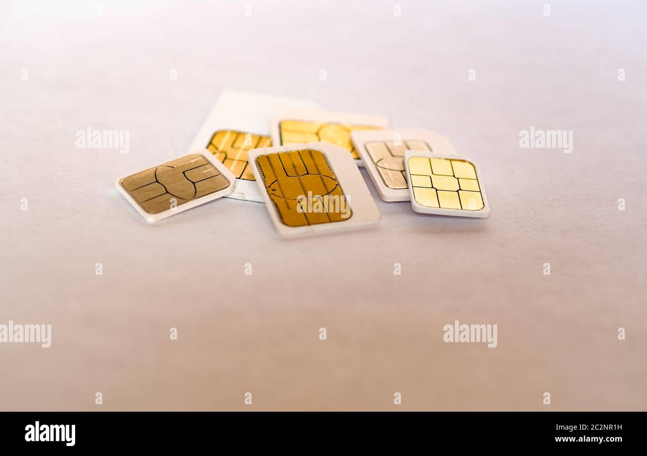 Many mini micro and nano sim cards for mobile telephone Stock Photo - Alamy