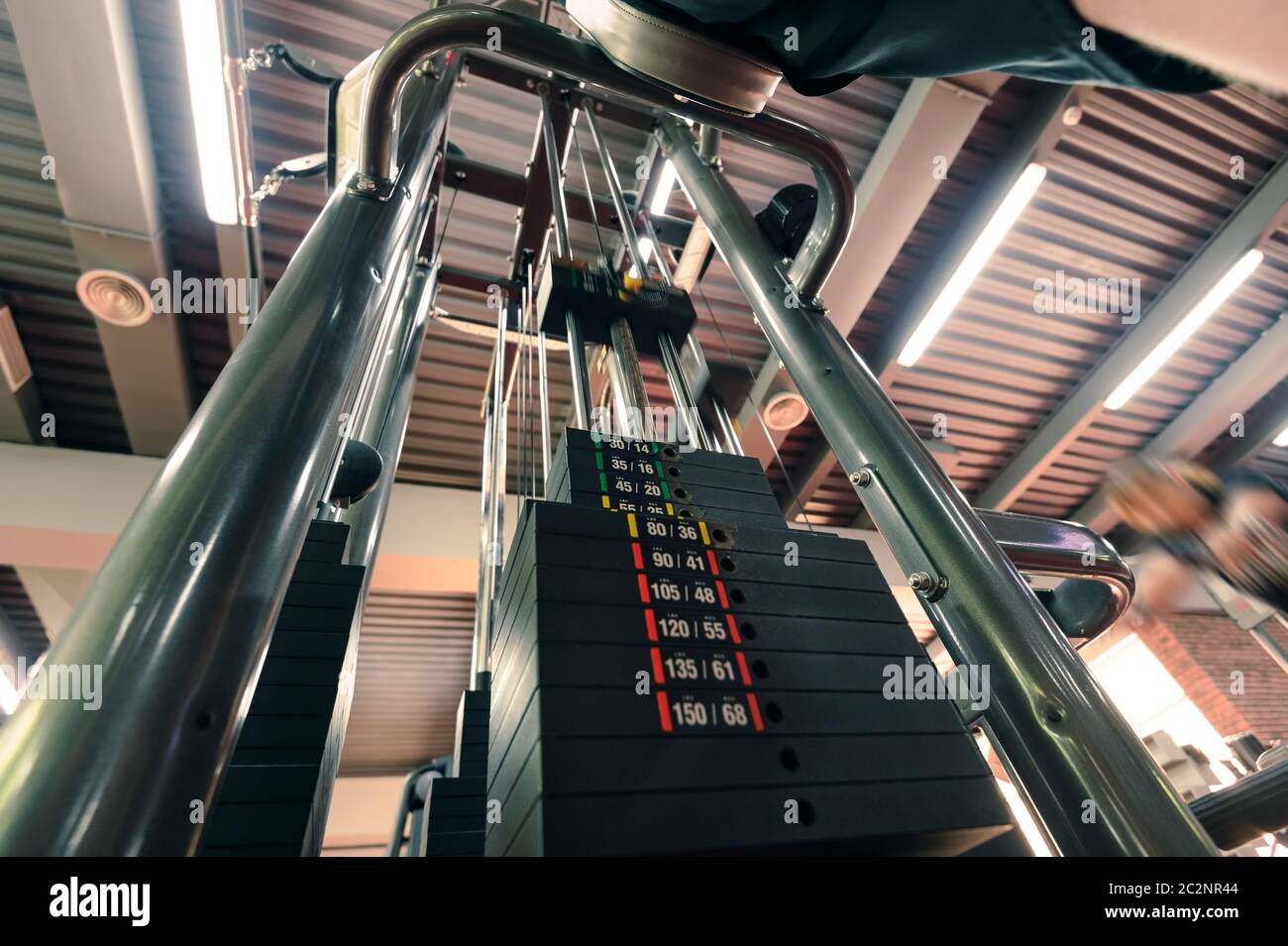 Weights in gym machine Stock Photo - Alamy