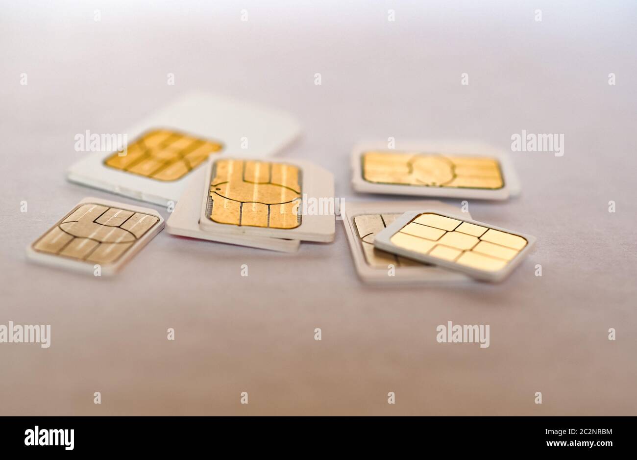 Many mini micro and nano sim cards for mobile telephone Stock Photo - Alamy