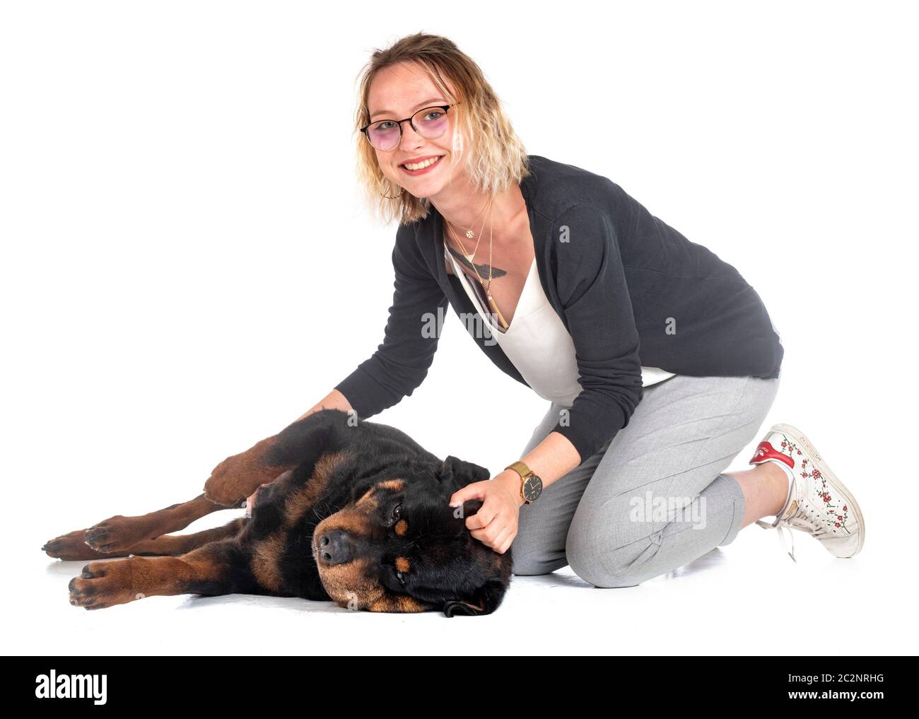 purebred rottweiler and woman in front of white background Stock Photo ...