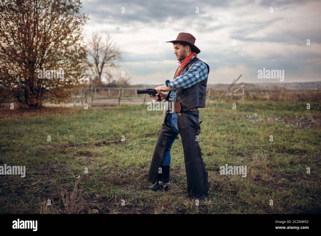 Brutal cowboy with revolver, gunfight on texas ranch, western. Vintage ...