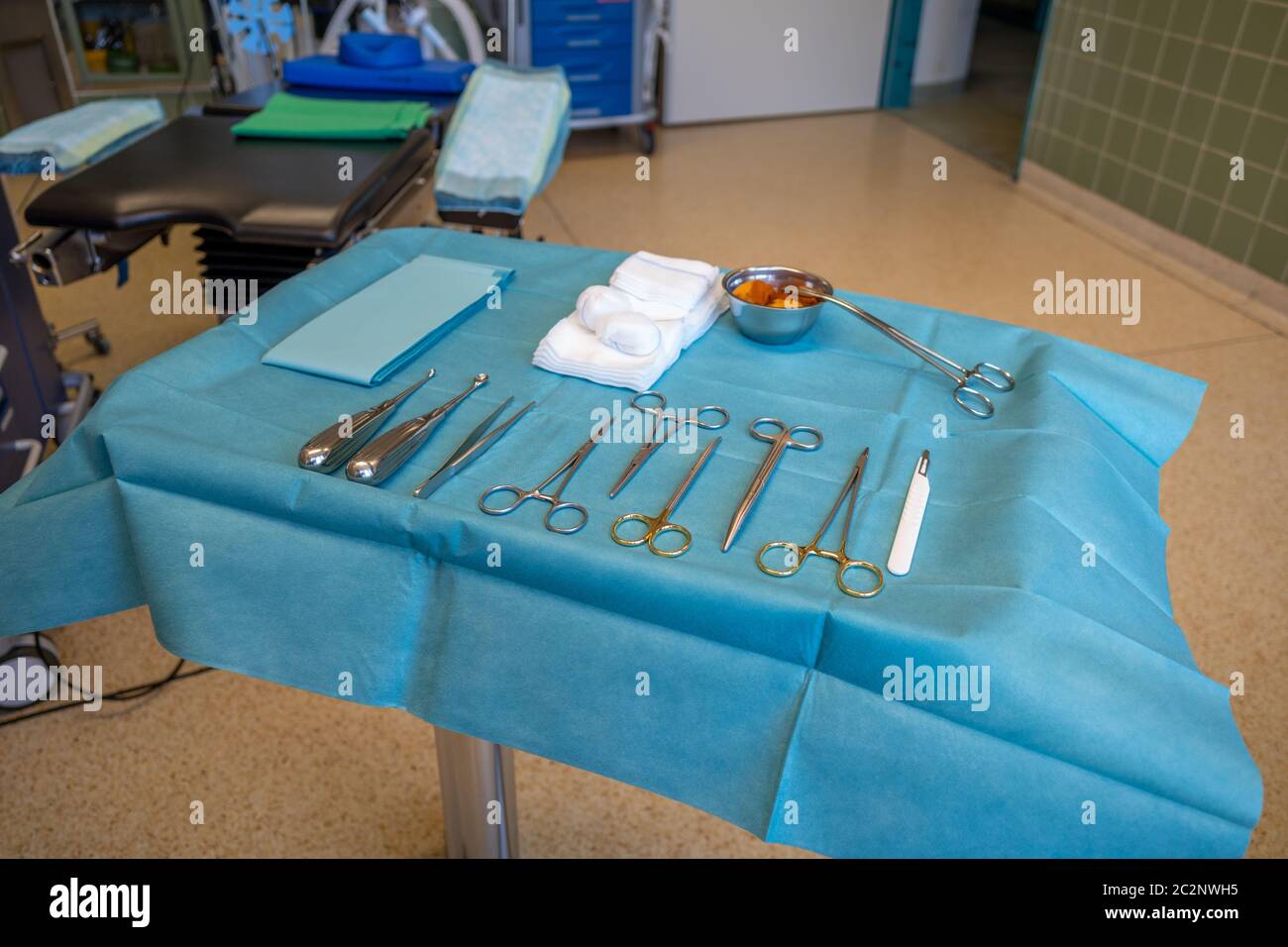 in an operating room there is an instrument table for performing wound ...