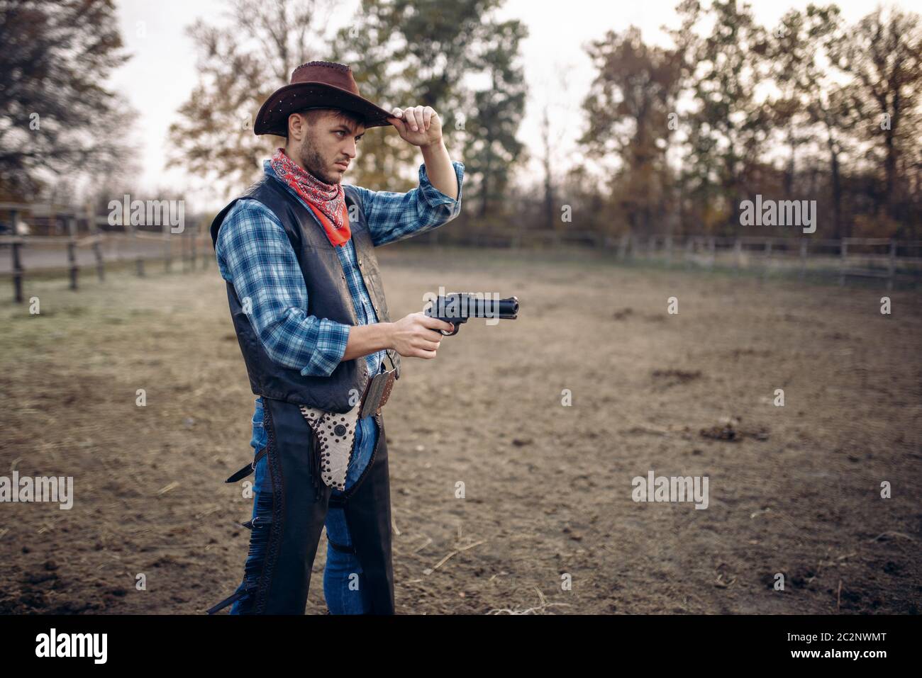 Cowboy with revolver, front view, gunfight on texas ranch, western ...