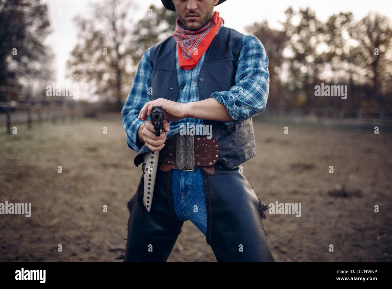 Cowboy with revolver, front view, gunfight on texas ranch, western ...