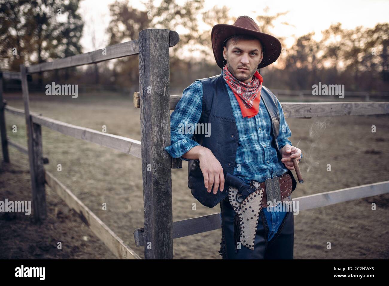 Brutal cowboy poses in the horse corral, texas ranch, western. Vintage ...