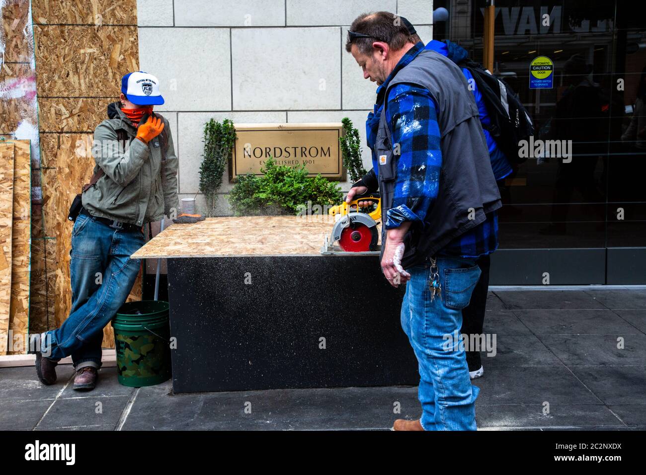 Seattle residents clean up the streets after the previous night's ...