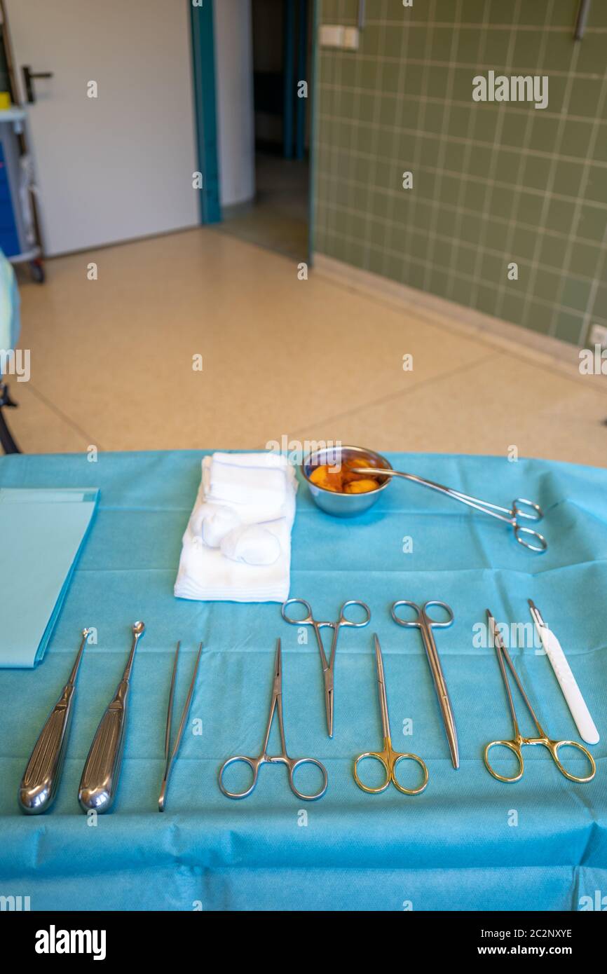 in an operating room there is an instrument table for performing wound ...