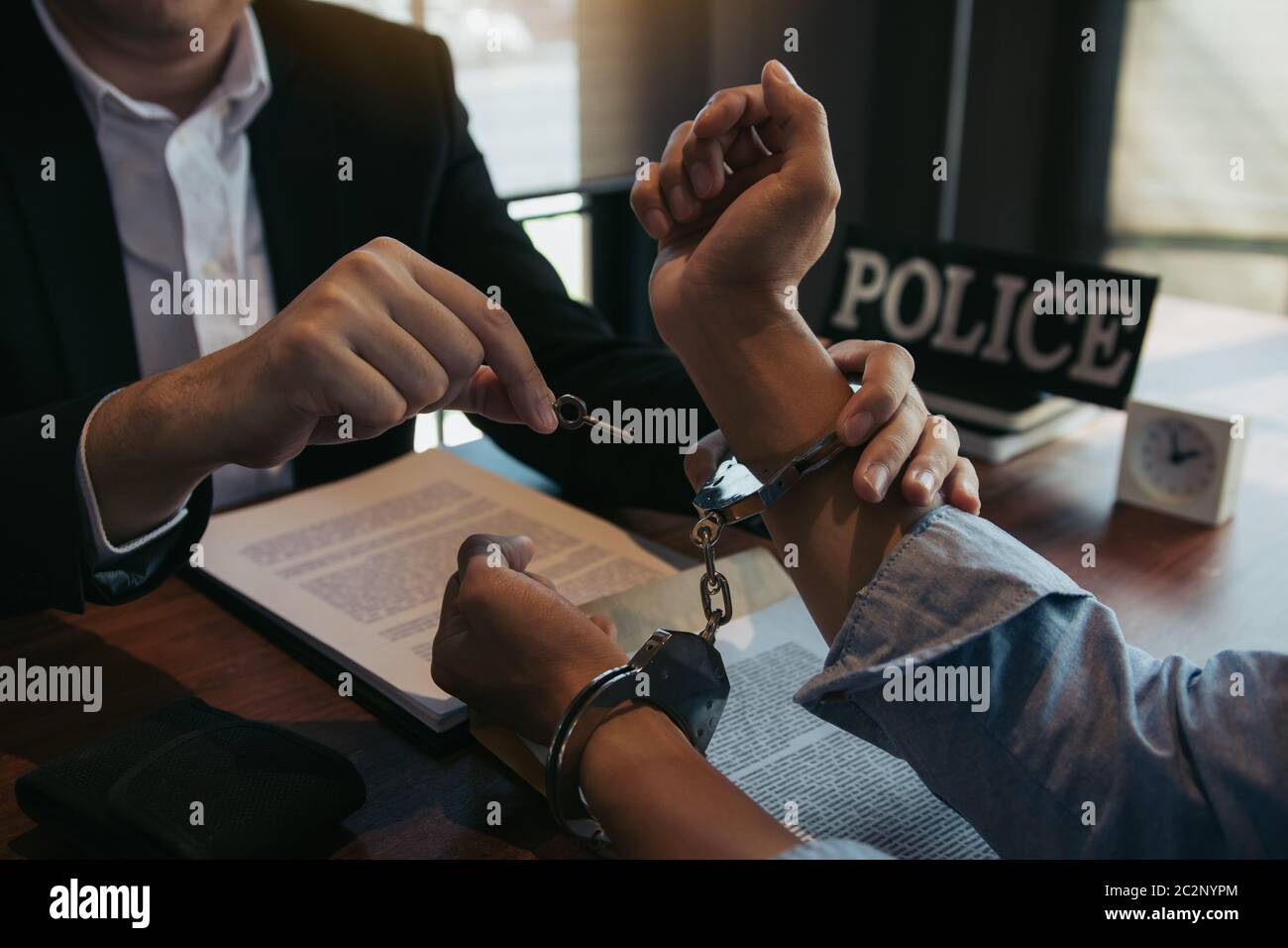Handcuffed suspect interrogation room hi-res stock photography and ...