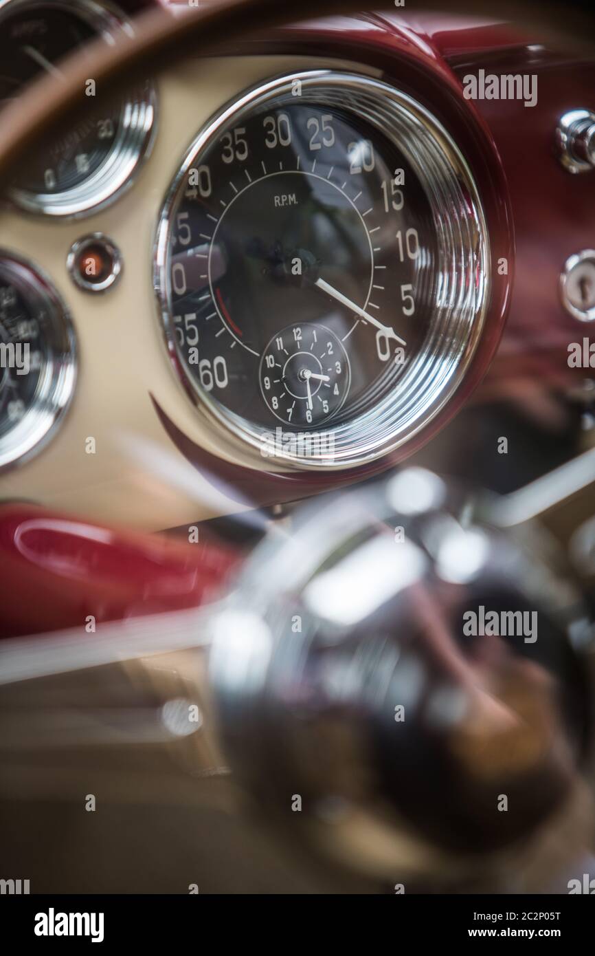 Color close up shot of a blue speedometer on a vintage car's dashboard ...